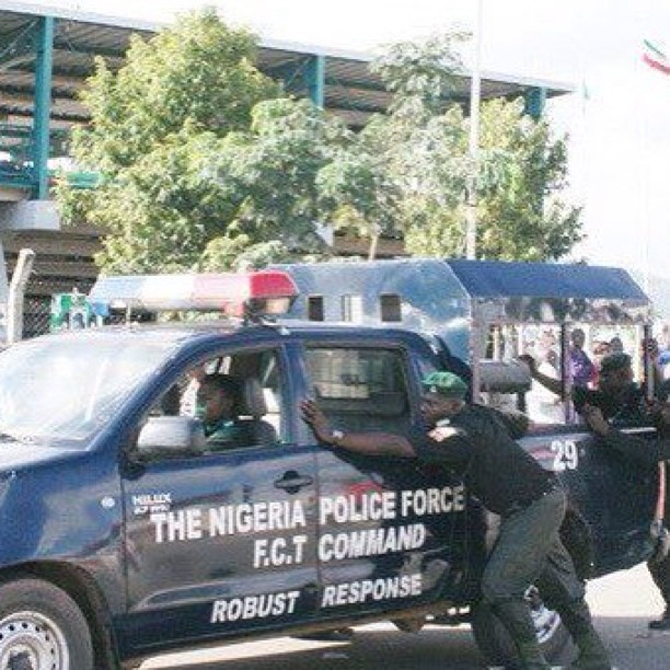 Funny Stuff: 'Robust response' Police squad pictured pushing vehicle