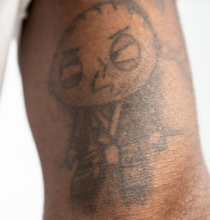 See 12 Of Burna Boy's Tattoos Perfectly Explained By Him